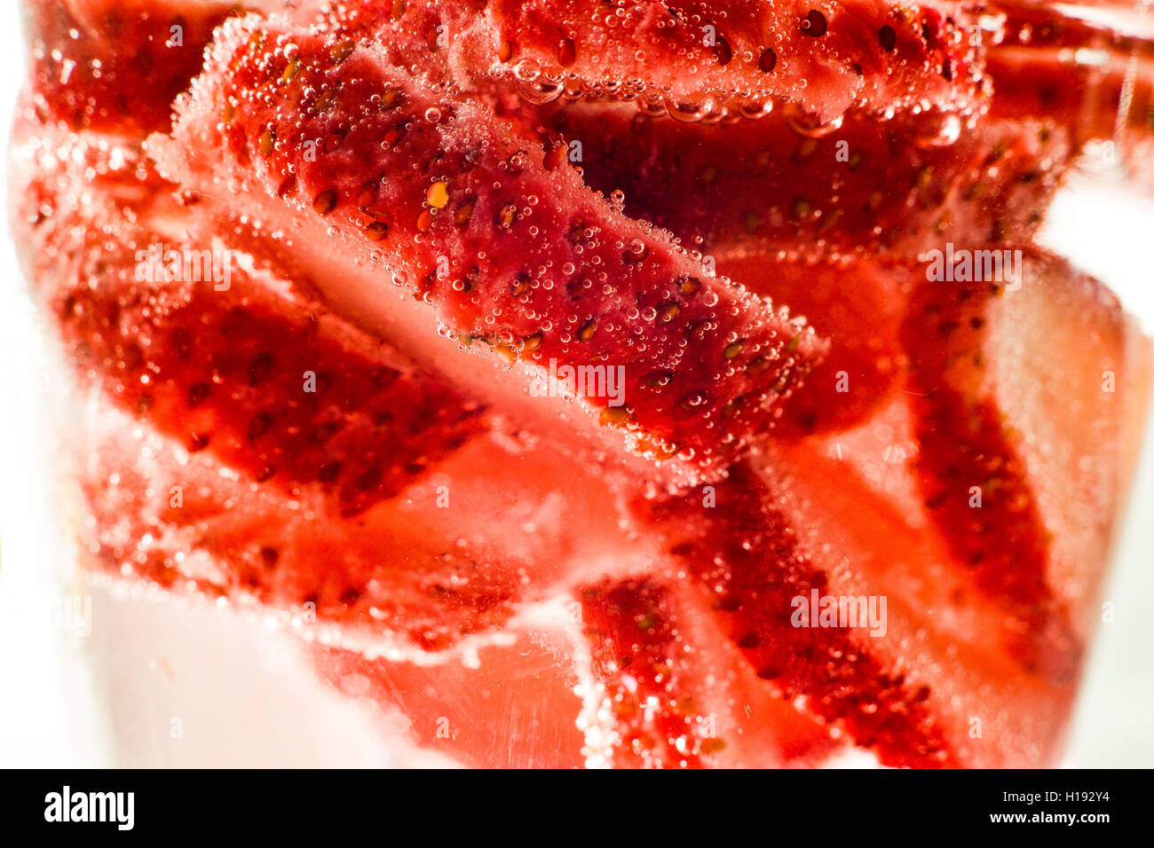 Strawberry berry in water in vials of gas Stock Photo - Alamy