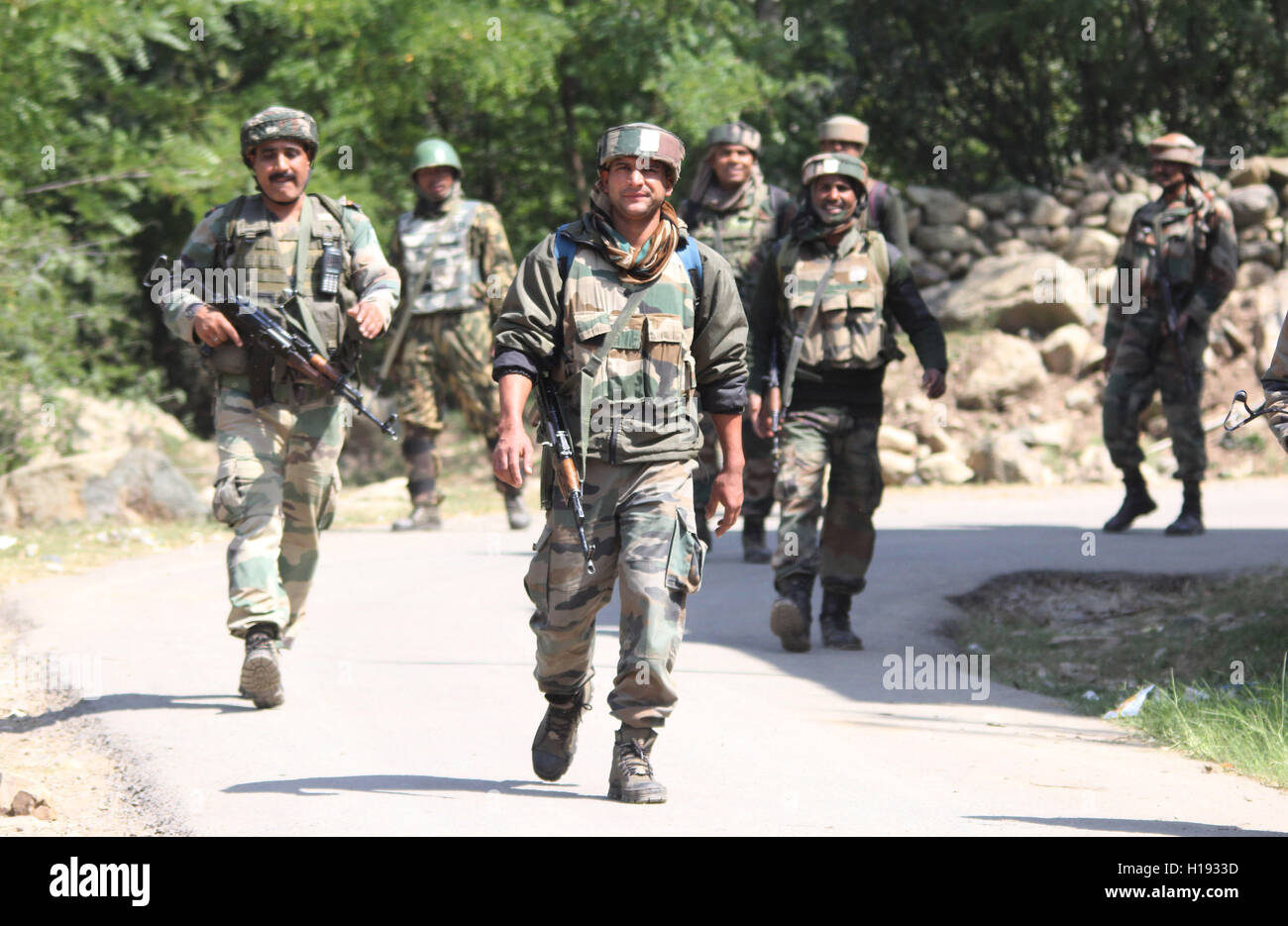 Srinagar, India. 22nd Sep, 2016. Indian army soldiers walk towards an ...