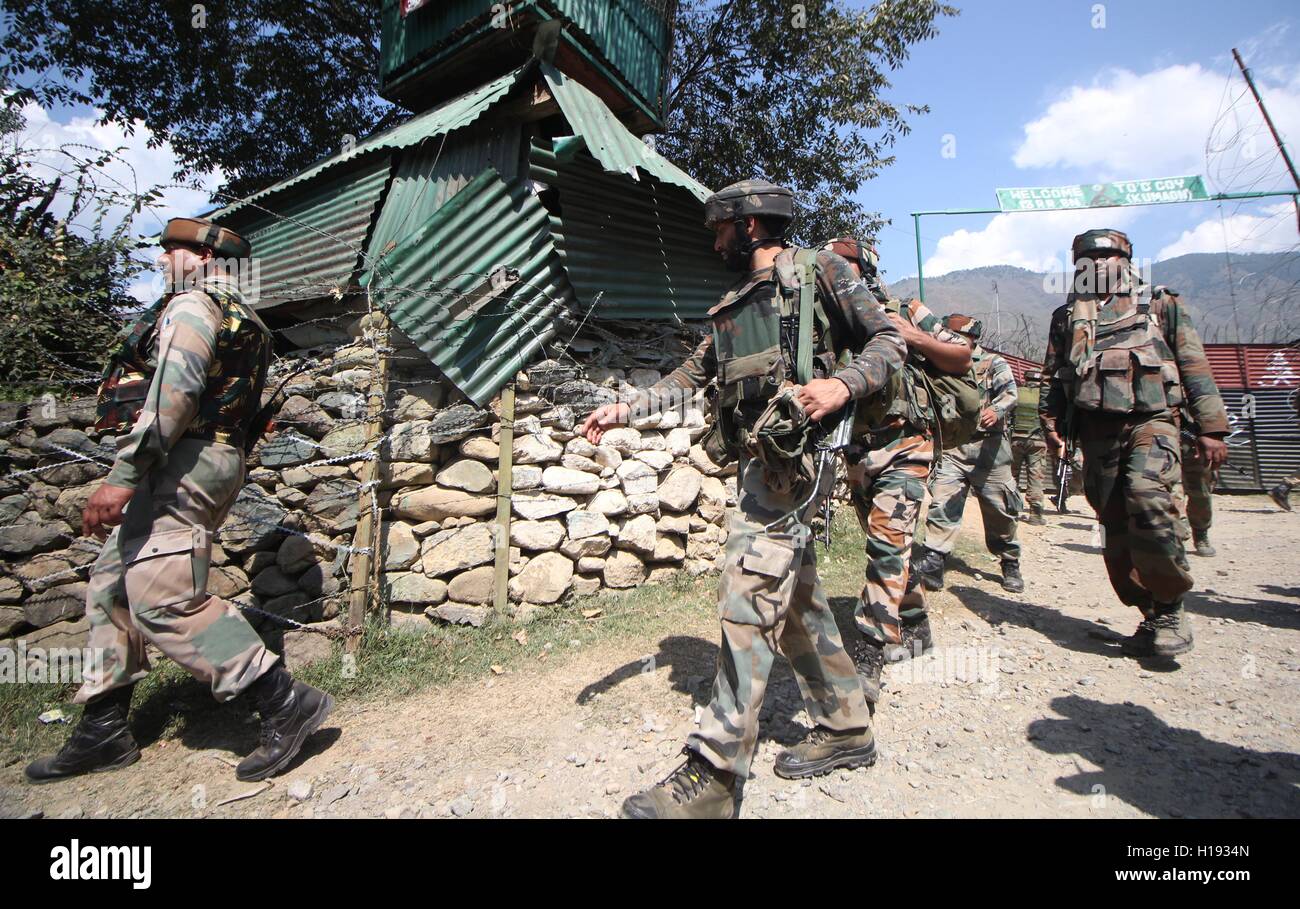 Srinagar, India. 22nd Sep, 2016. Indian army soldiers walk towards an ...