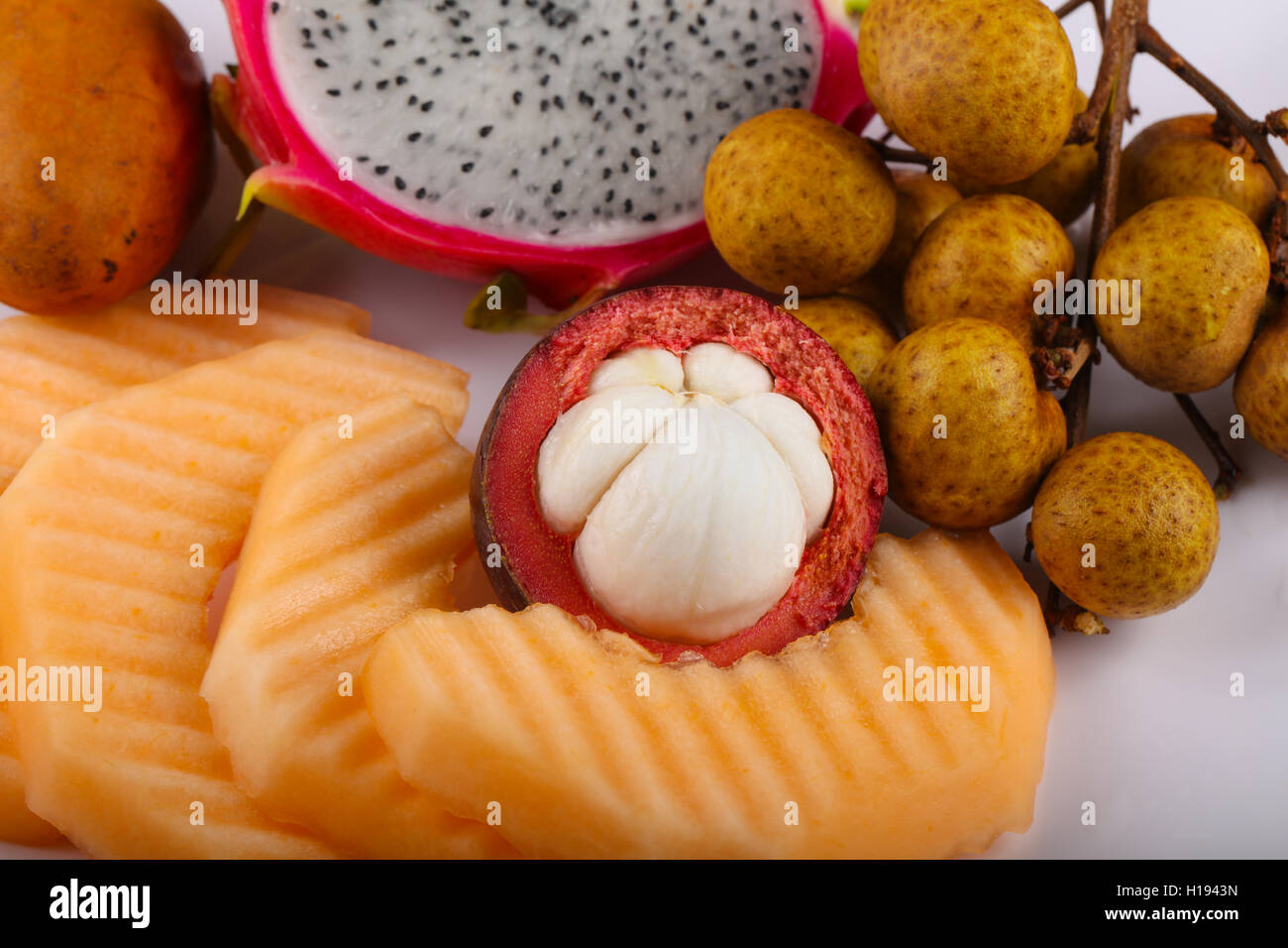 Tropical fruit mix - melon, longan, mangosteen, dragonfruit Stock Photo ...