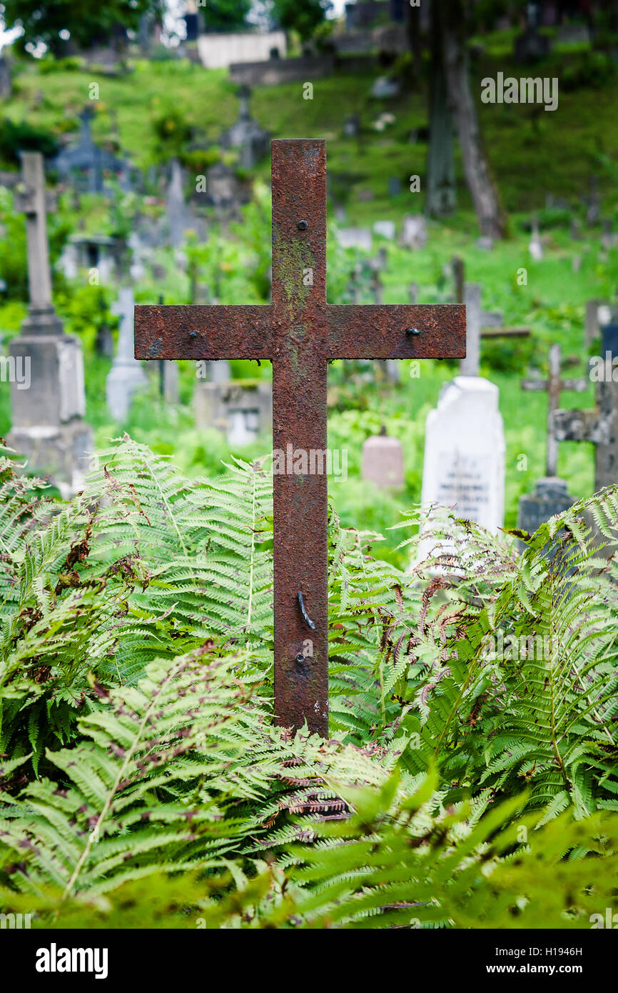 Old rusty metal cross in a cemetery, forgotten grave Stock Photo - Alamy