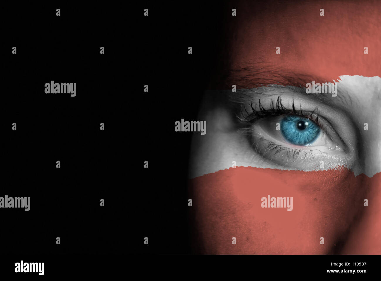 A young female with the flag of Austria painted on her face on her way ...