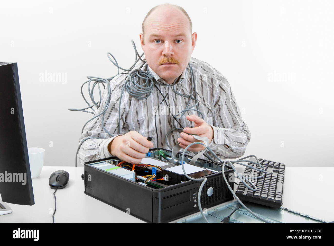 Mature Technician Repairing Computer At Desk Stock Photo - Alamy