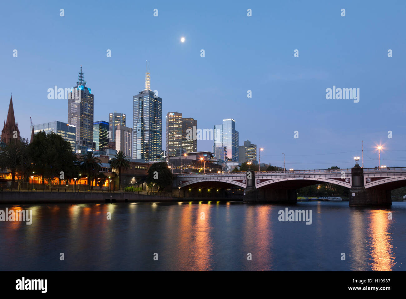 Sunset and new moon over Melbourne's CBD looking towards Flinders ...