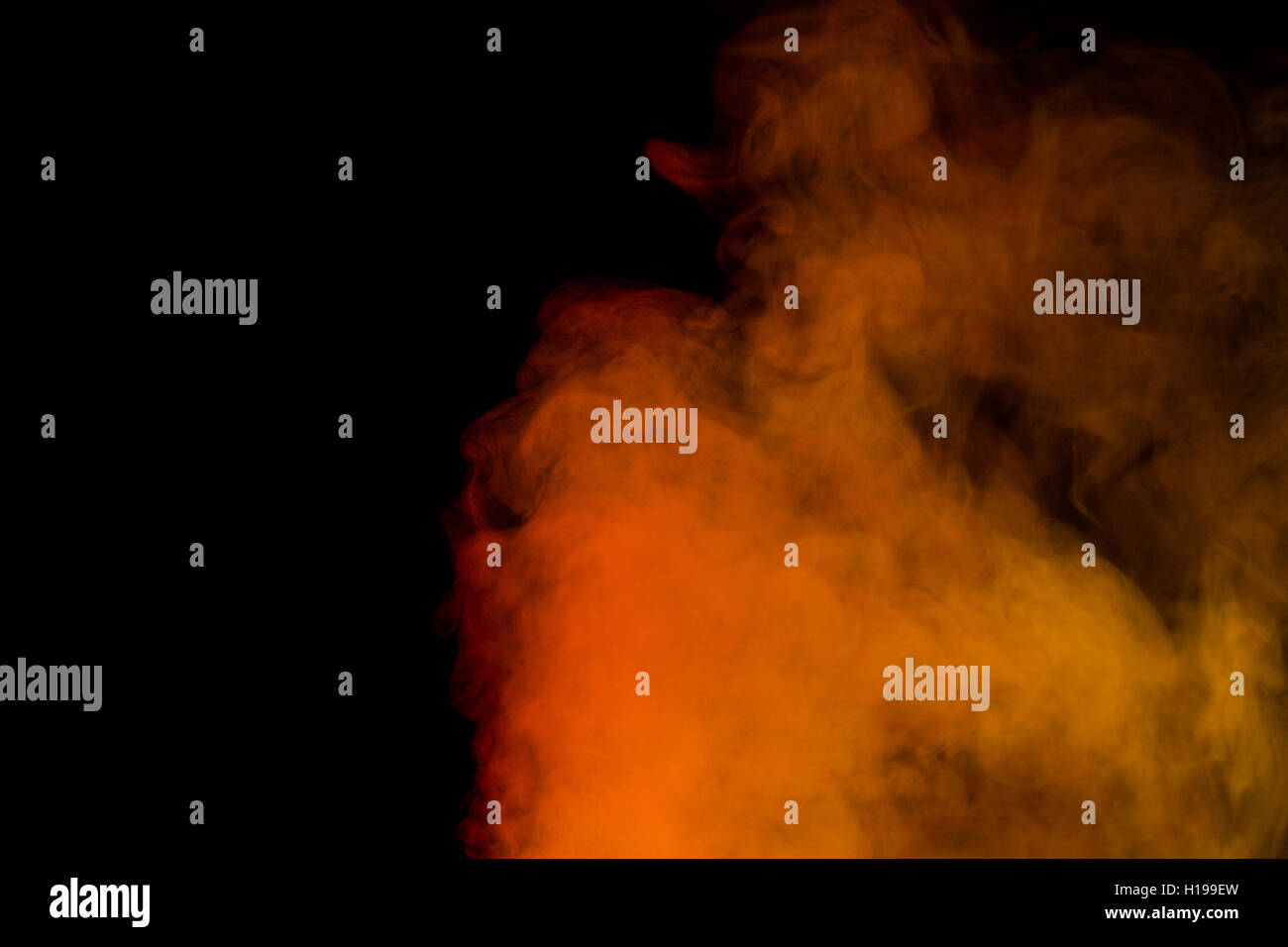 Abstract red yellow water vapor on a black background. Texture. Design ...