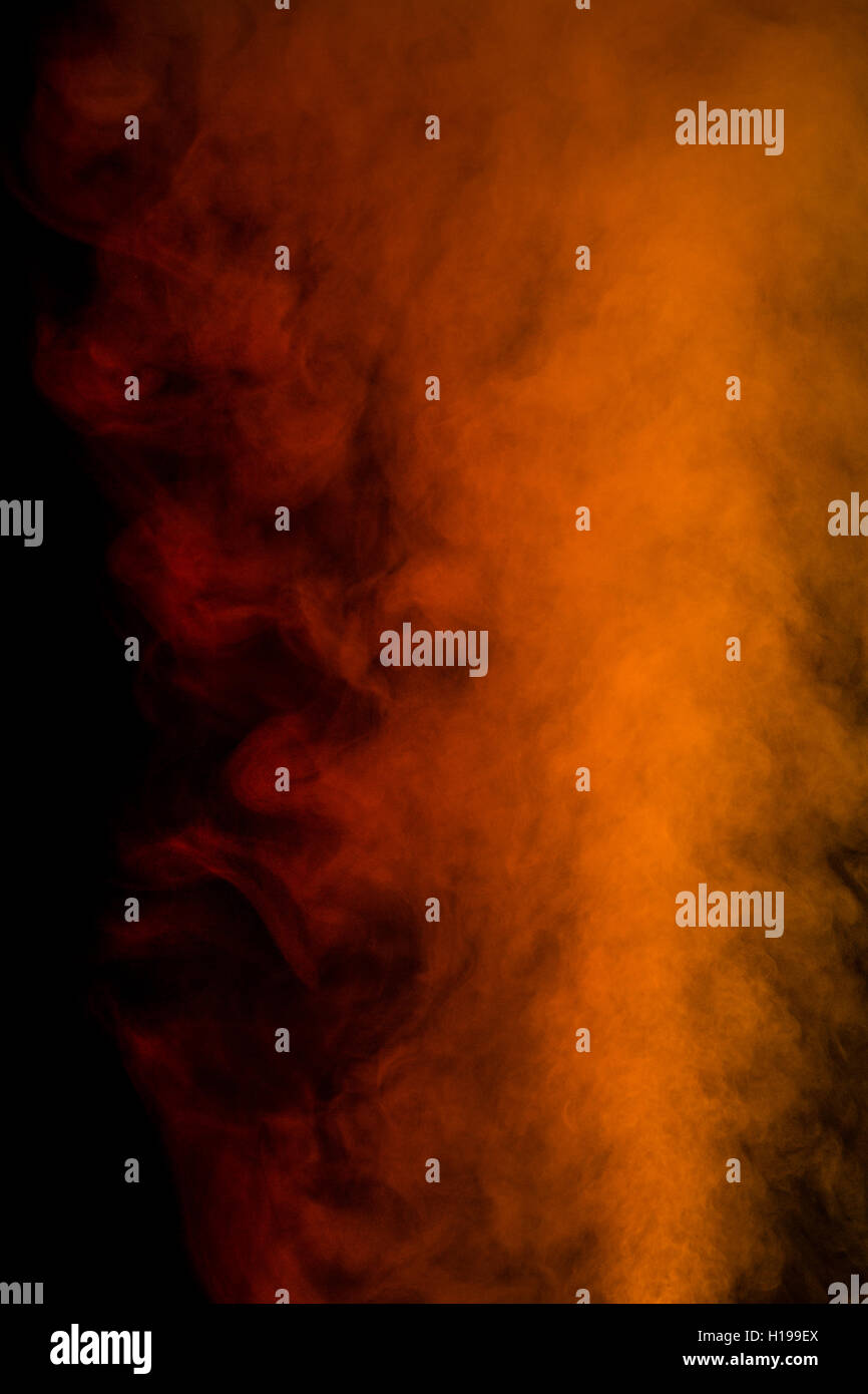 Abstract red yellow water vapor on a black background. Texture. Design ...