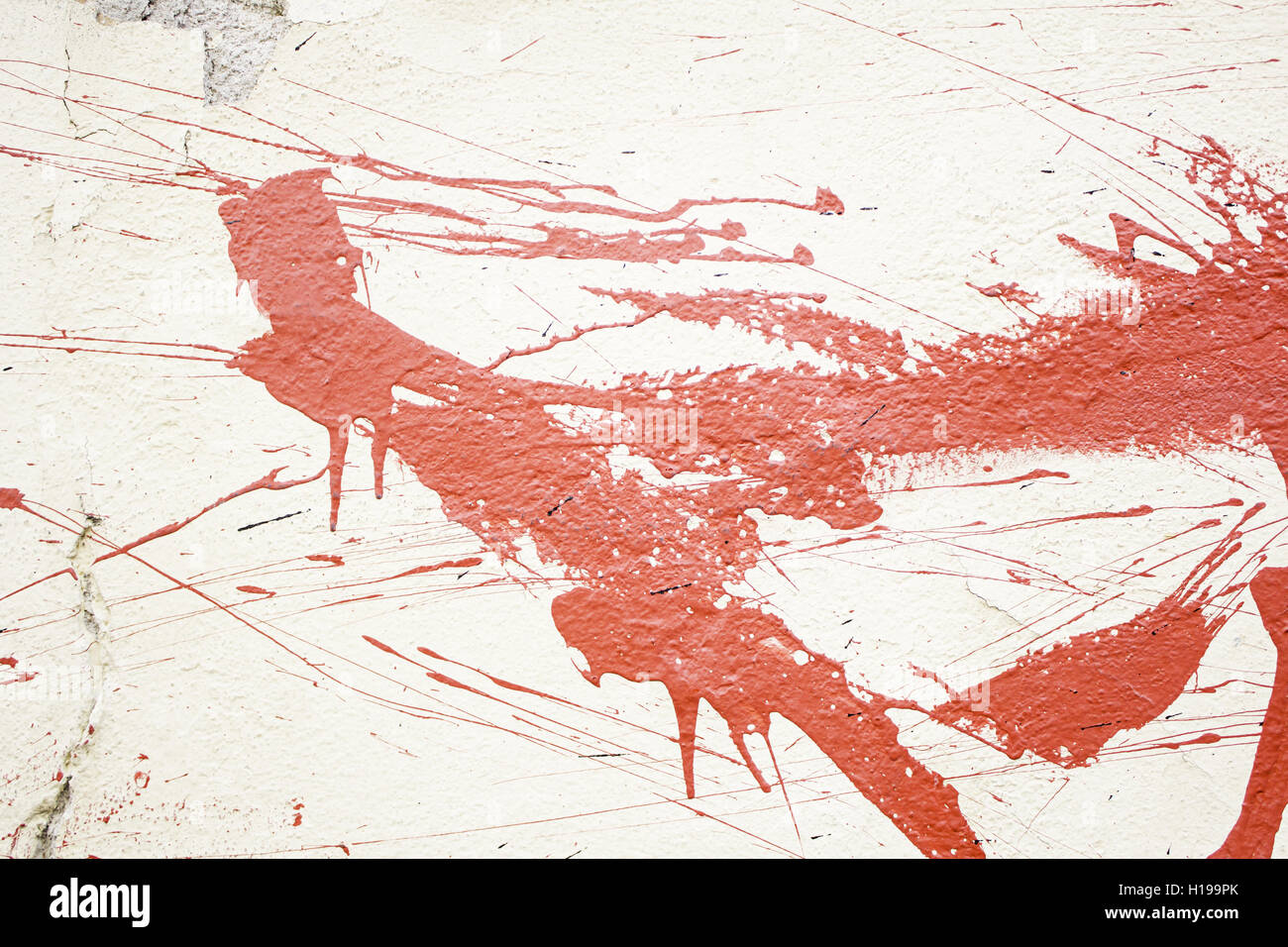 Red paint on urban wall decor and color Stock Photo - Alamy