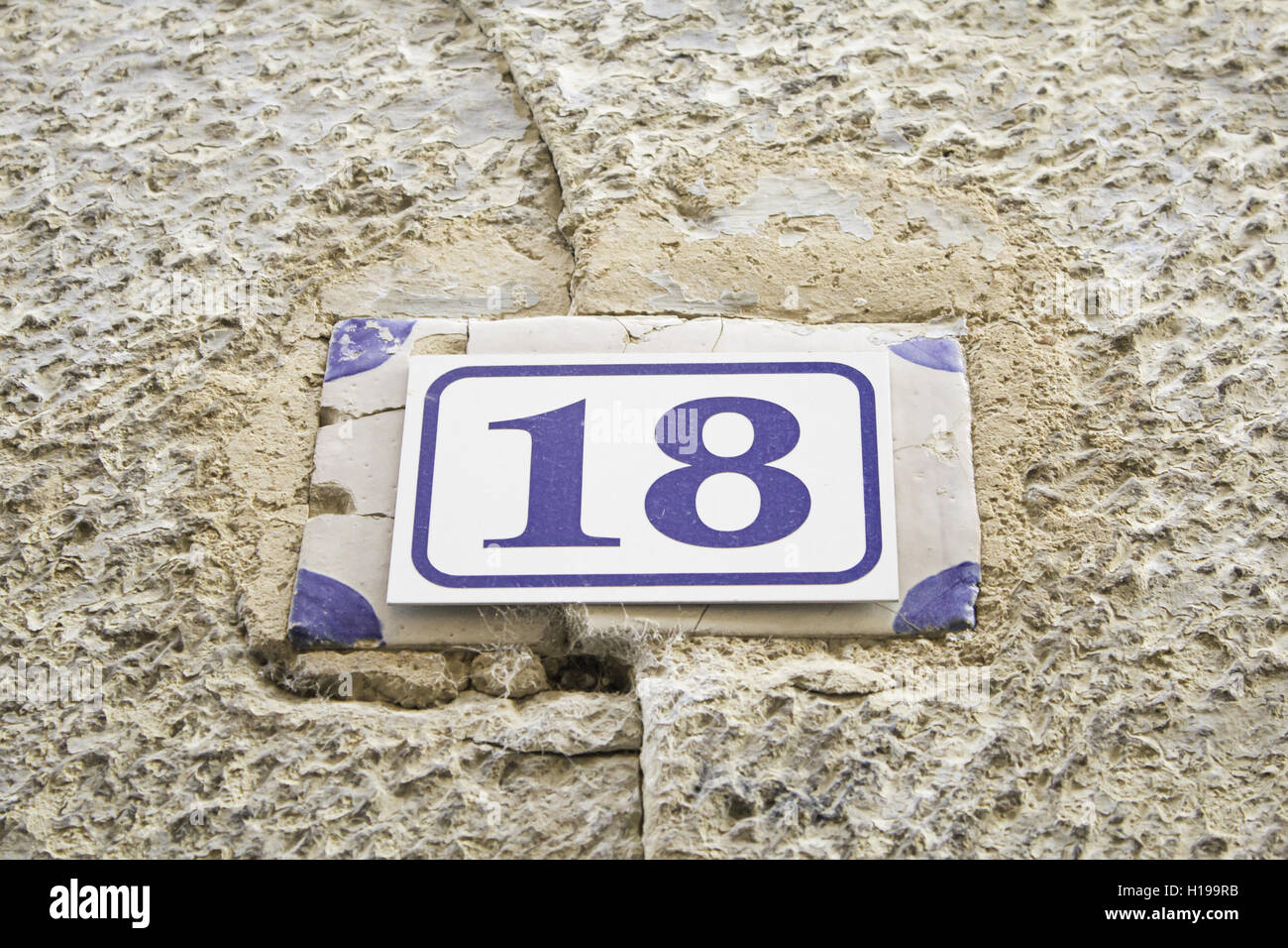 Number eighteen in townhouse, address Stock Photo - Alamy