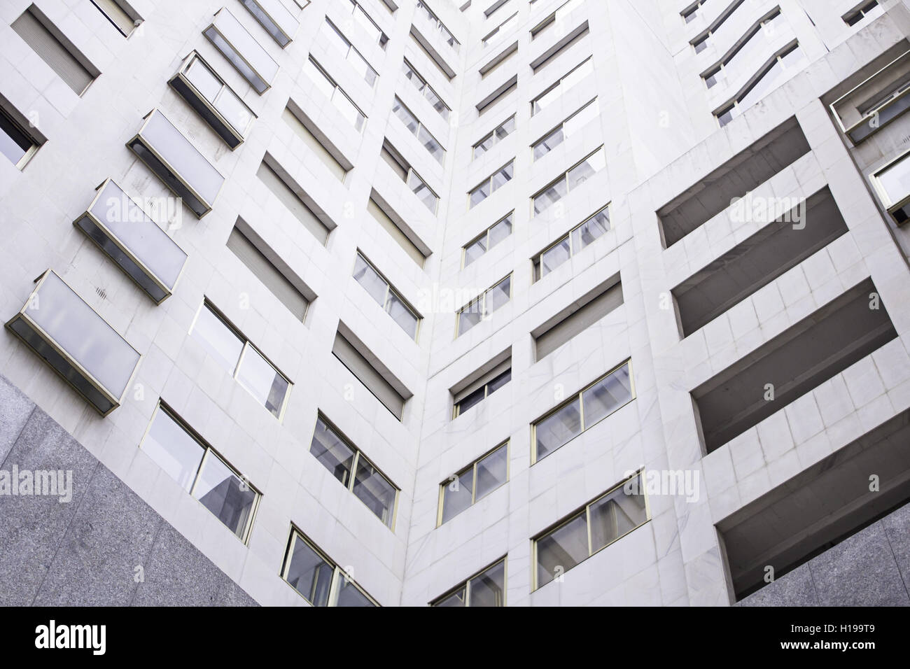 White skyscraper in urban road construction Stock Photo - Alamy