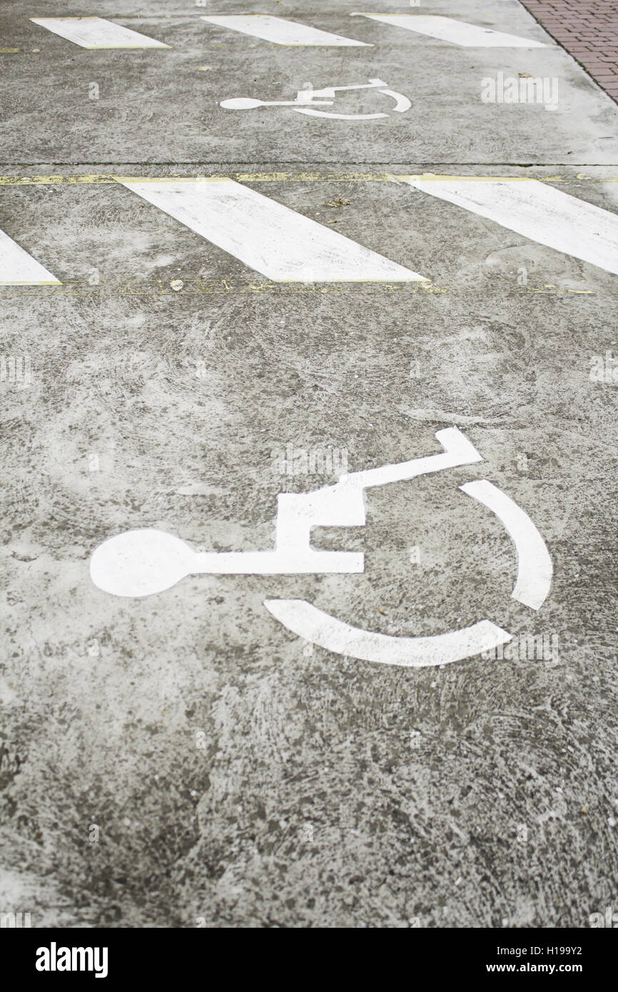 Symbol disabled urban road street sign Stock Photo - Alamy