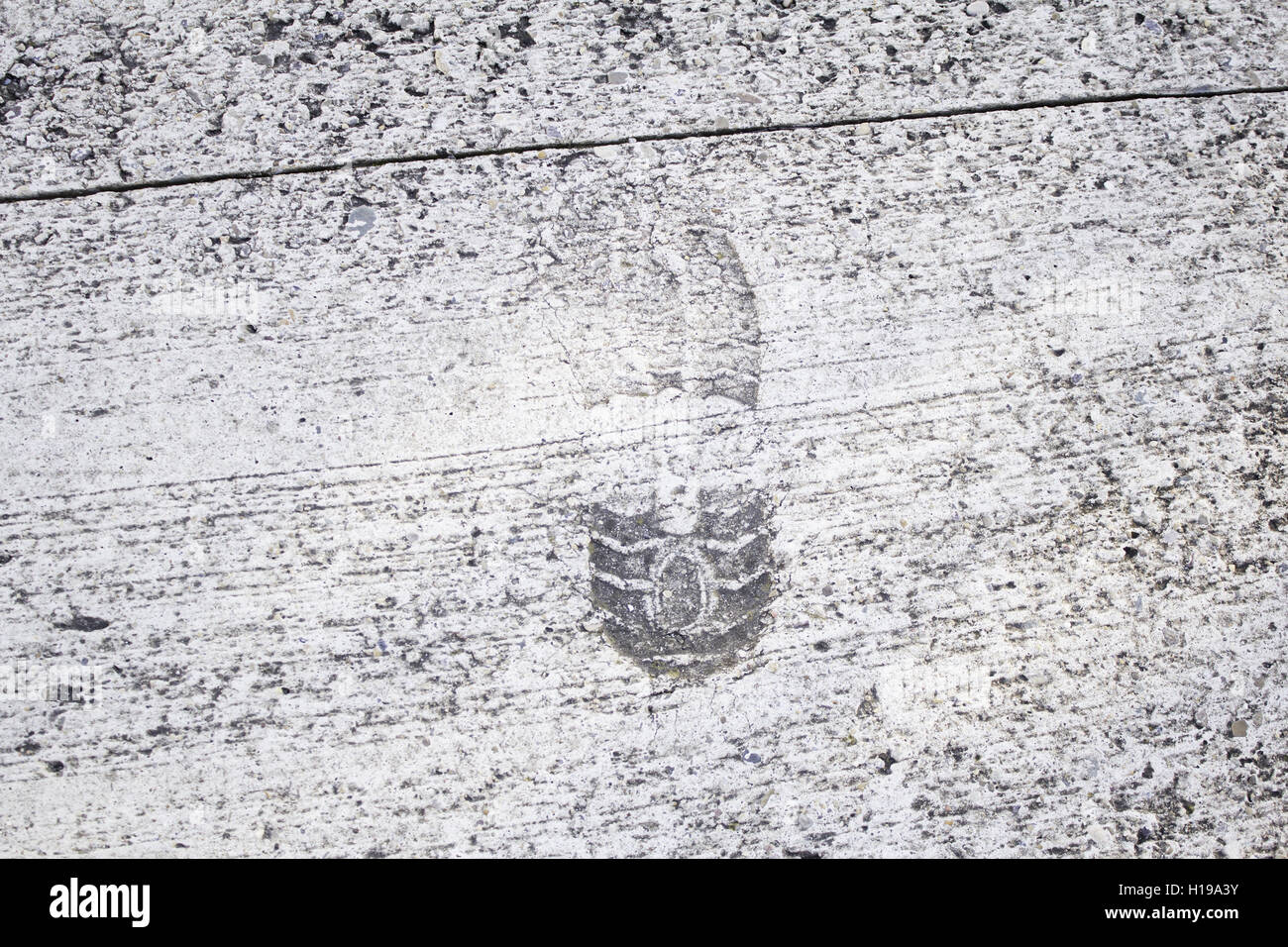 Shoe sole cement street, symbol Stock Photo - Alamy