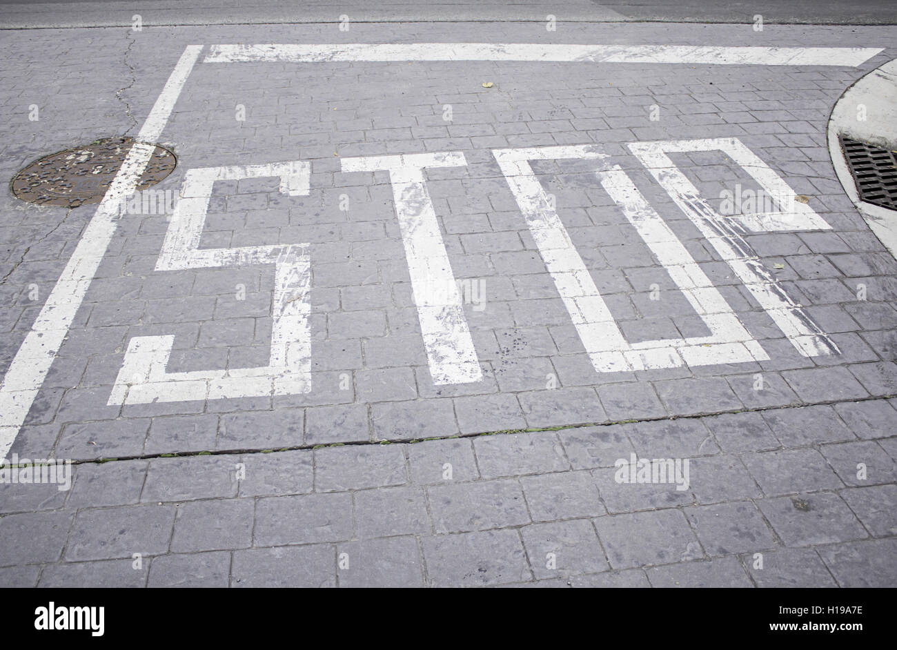 Signs warning to stop at urban road, symbol Stock Photo - Alamy