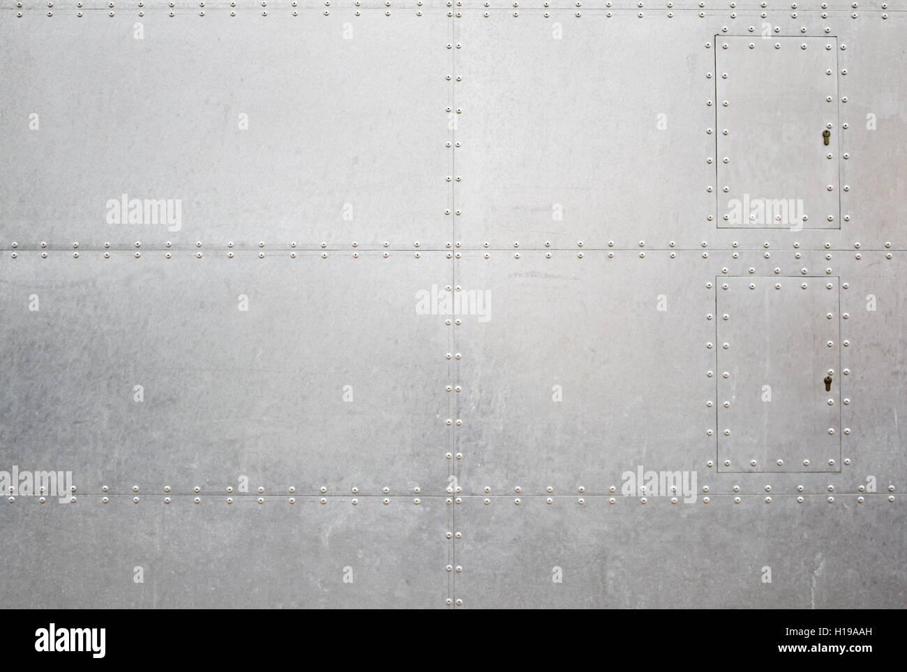 Metal wall with security screws, construction Stock Photo - Alamy
