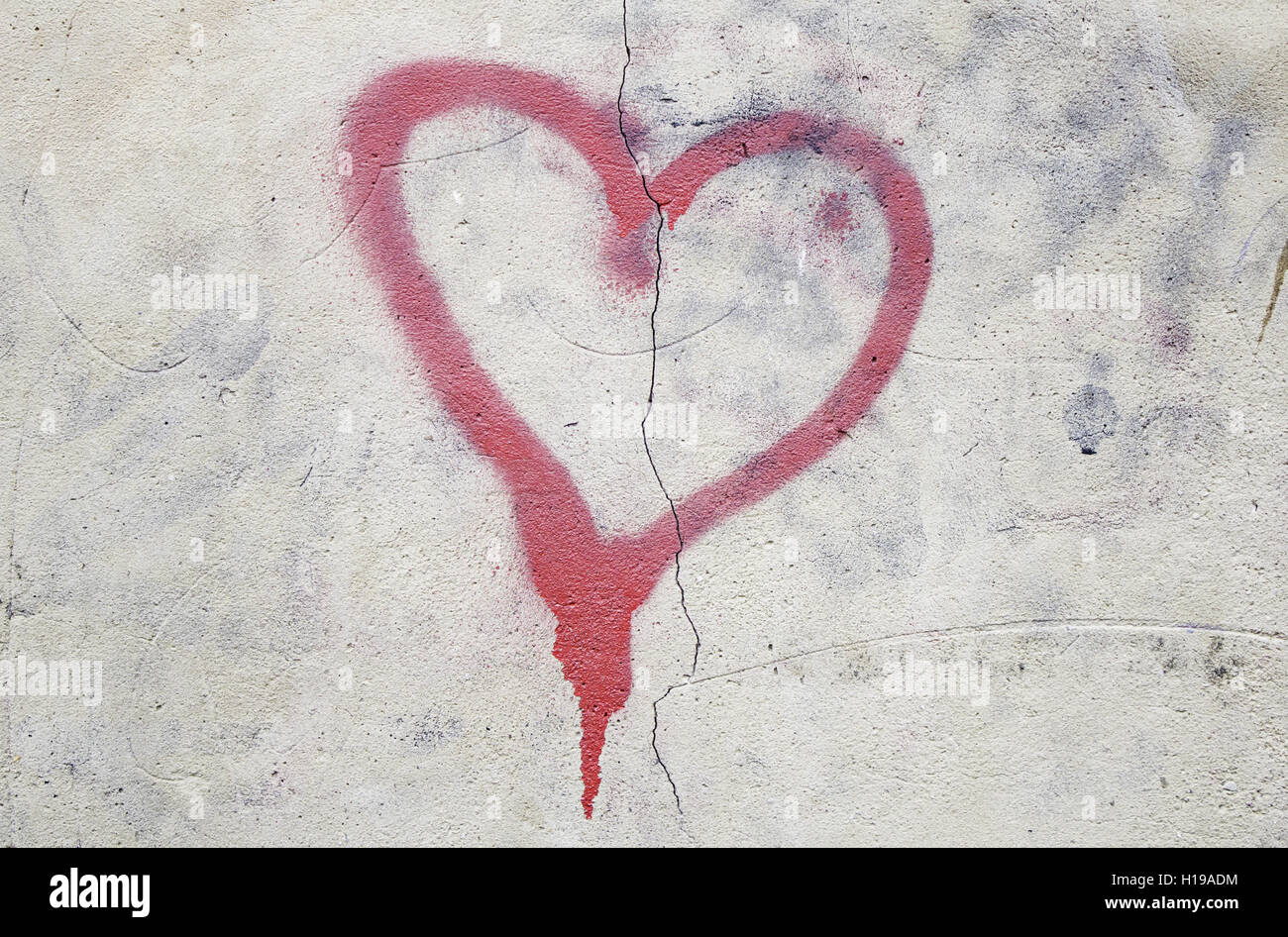 Urban red heart painted on wall, symbol Stock Photo - Alamy