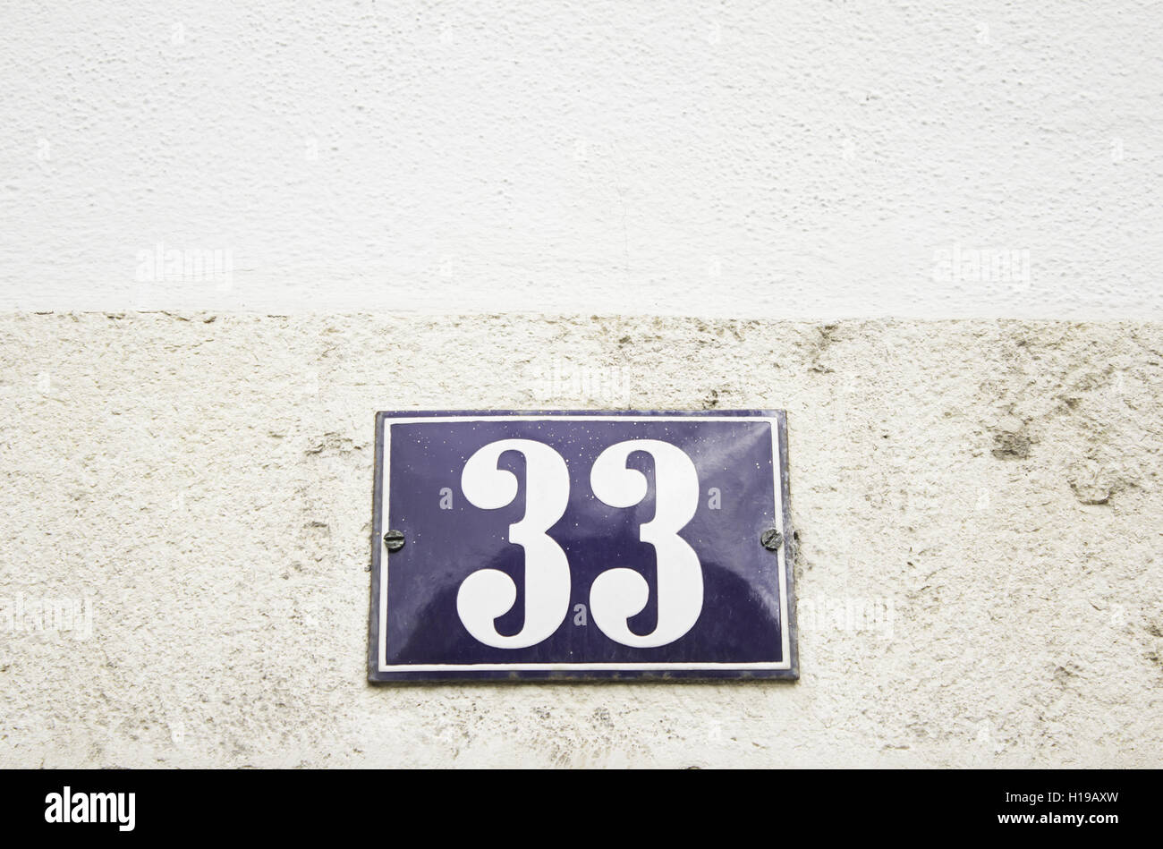 Number thirty-three in front of building, house Stock Photo - Alamy