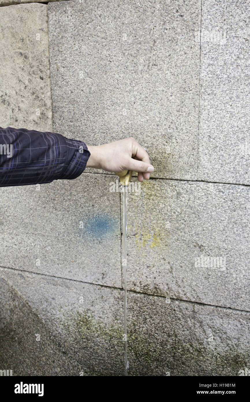 Pressing tap water in open source Stock Photo - Alamy