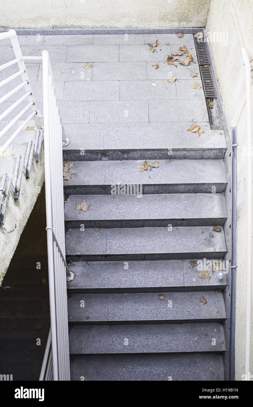 Stairs gray garage with safety railing Stock Photo - Alamy