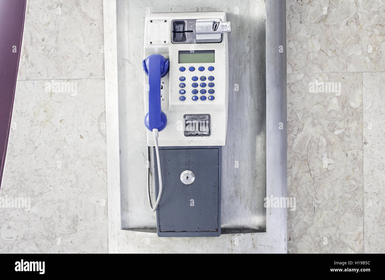 Metal phone booth city street, communication Stock Photo - Alamy