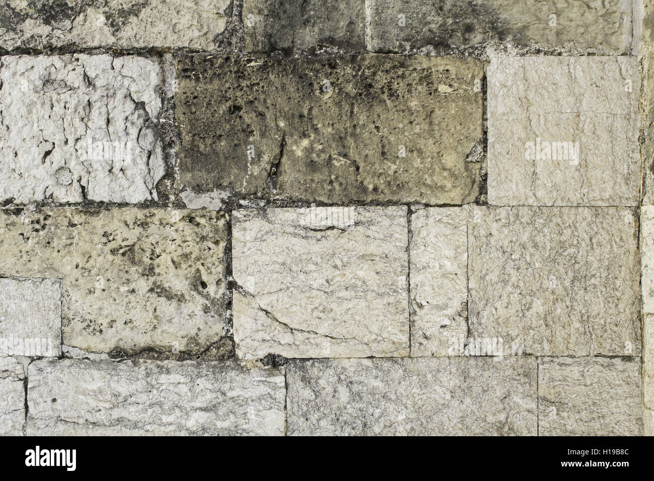 Old stone wall in urban street, construction Stock Photo - Alamy