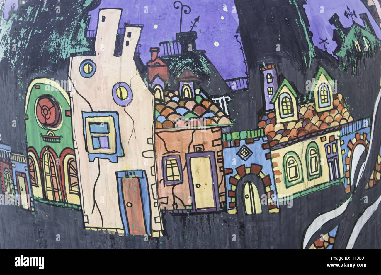 Colorfully painted houses in urban wall Stock Photo - Alamy