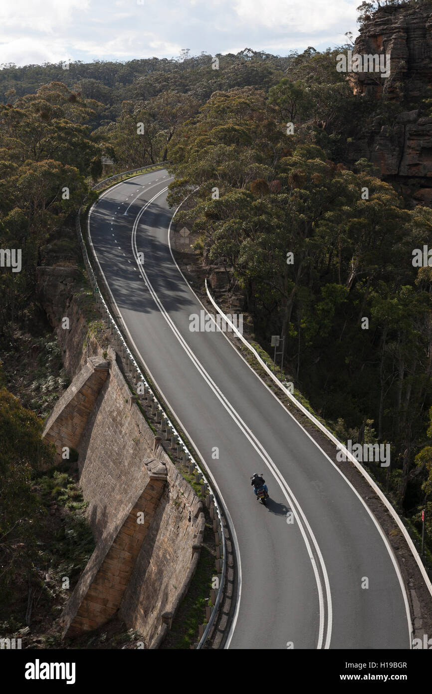 A motorcycle rider quickly crosses the Victoria Pass a masterpiece of ...