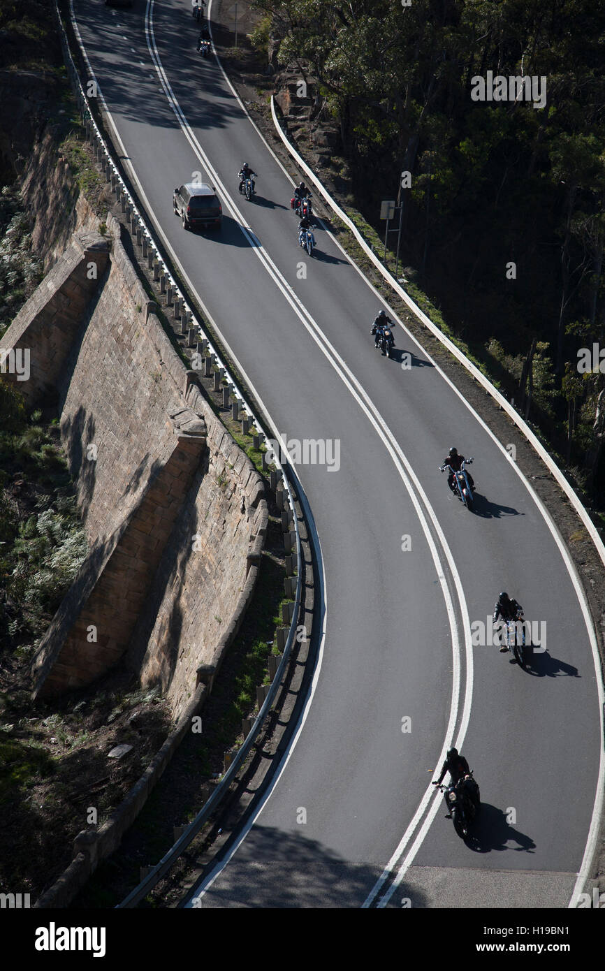 Group of motorcycle riders negotiating the convict built Victoria Pass ...