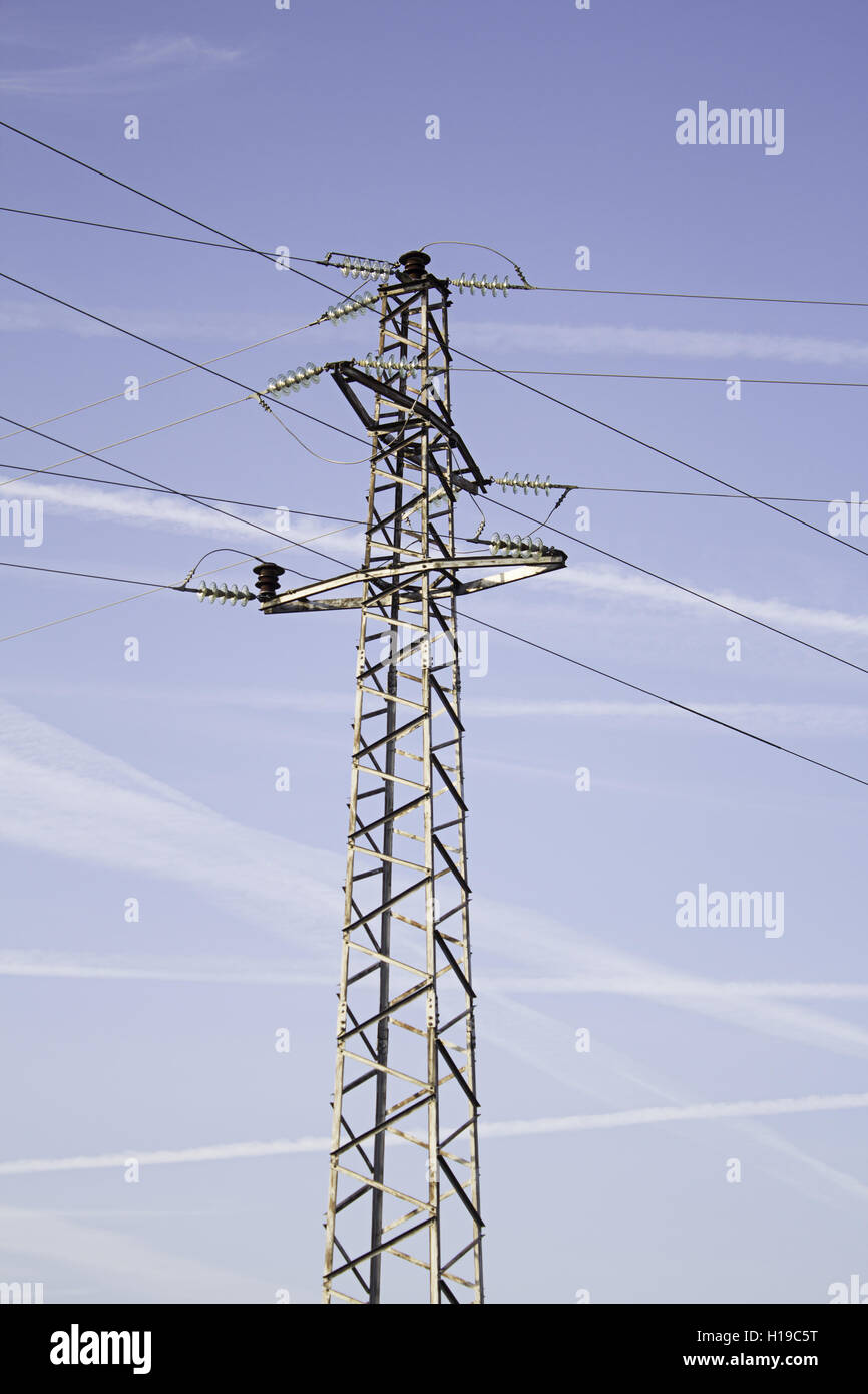 Electric tower in urban street with blue sky, industry Stock Photo - Alamy