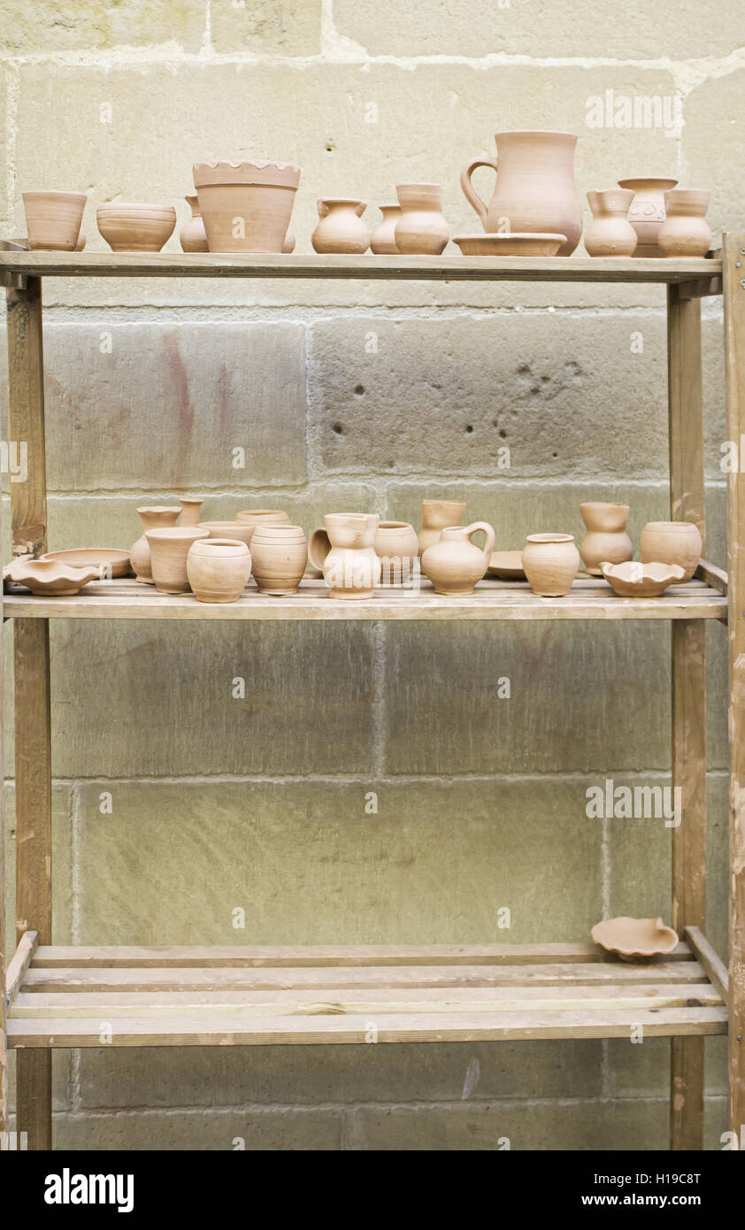 Shelf clay and ceramic vases, sale Stock Photo - Alamy