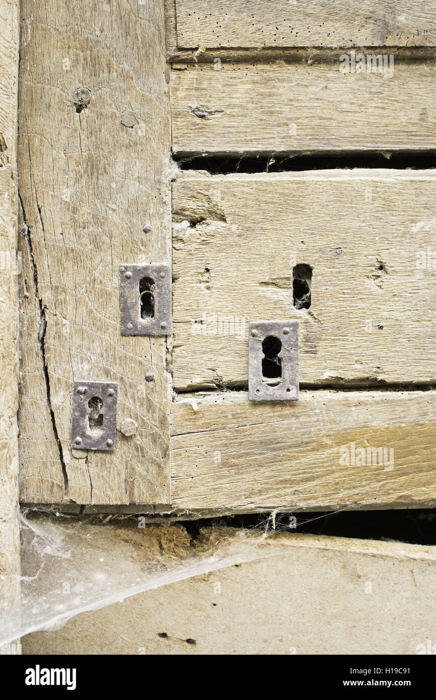 Old iron lock on wooden door, construction Stock Photo - Alamy