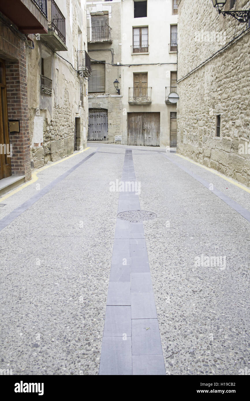 Narrow village street with houses, construction Stock Photo - Alamy