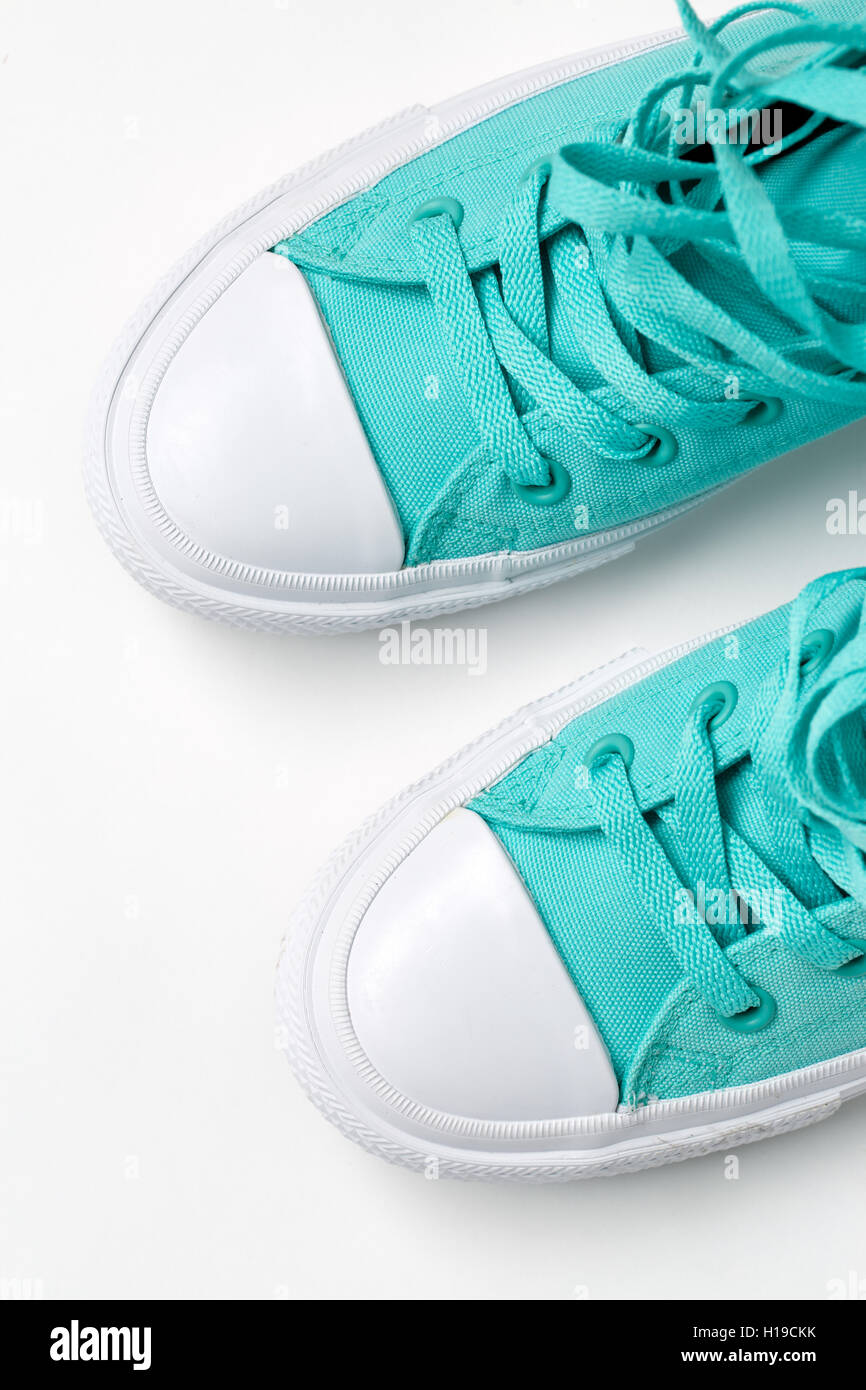 Top view of turquoise sneakers on white background Stock Photo - Alamy