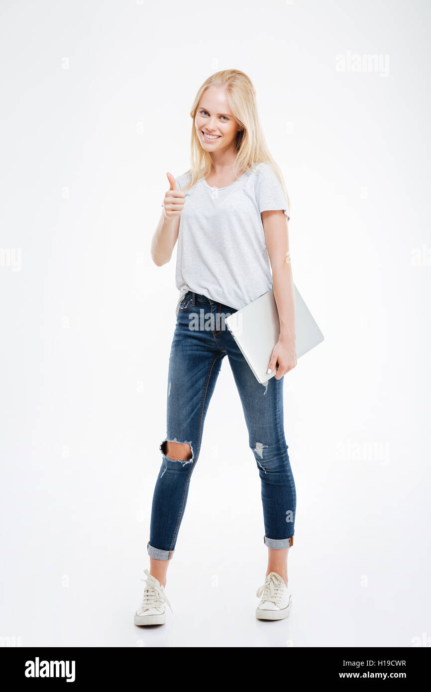 Beautiful girl holding laptop pointing hi-res stock photography and ...