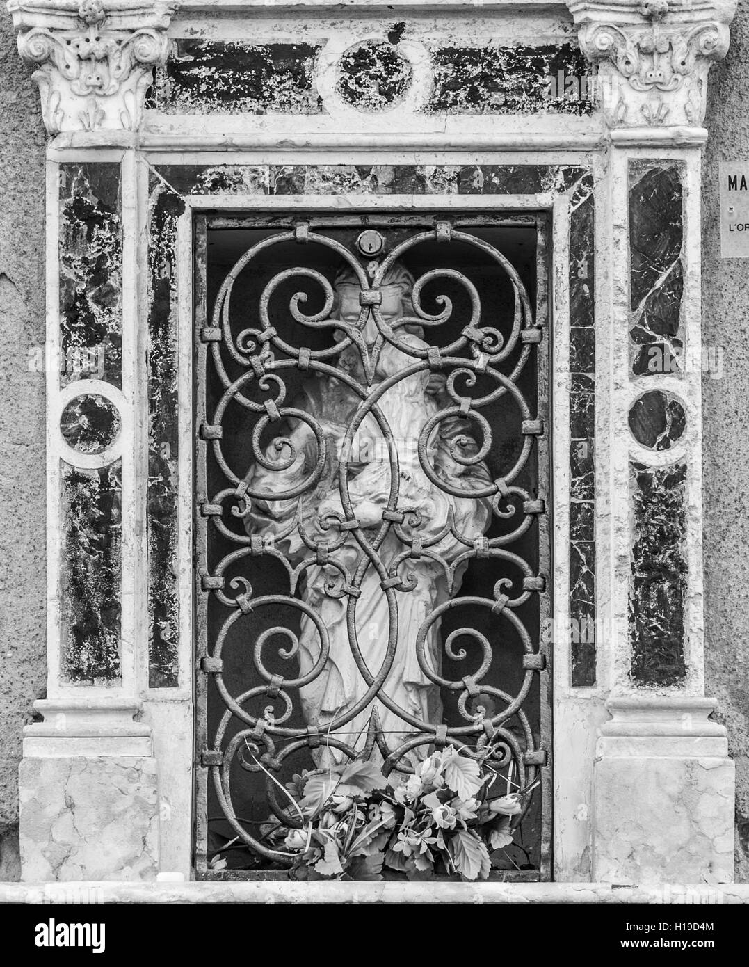A catholic votive shrine on the wall of the St. Giacomo da l'Orio ...