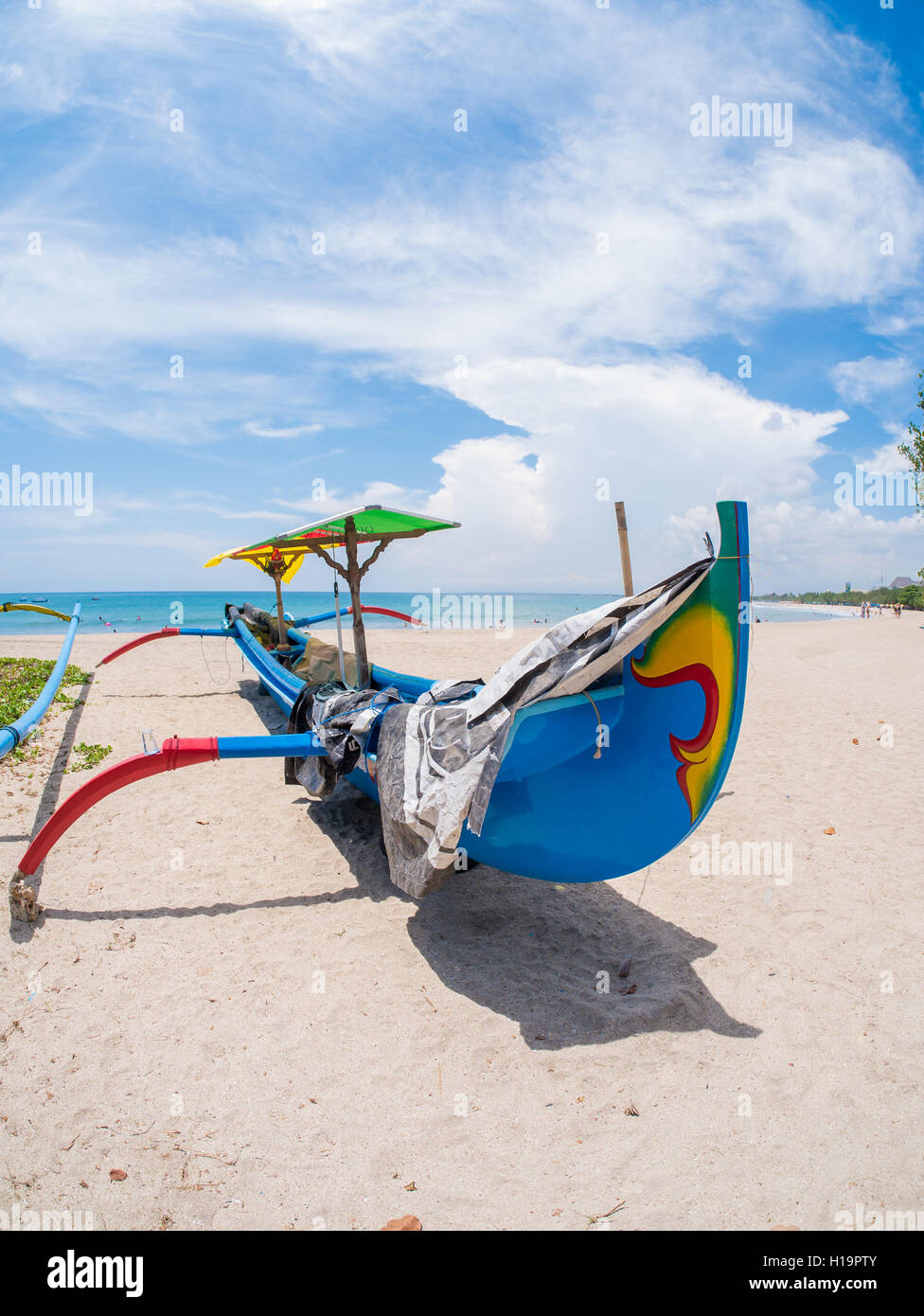 Traditional balinese "dragonfly" boat on the beach in Kuta Bali ...