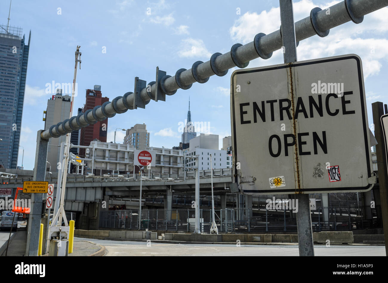 Entrance Open Sign in New York, with the Manhattan skyline in the ...