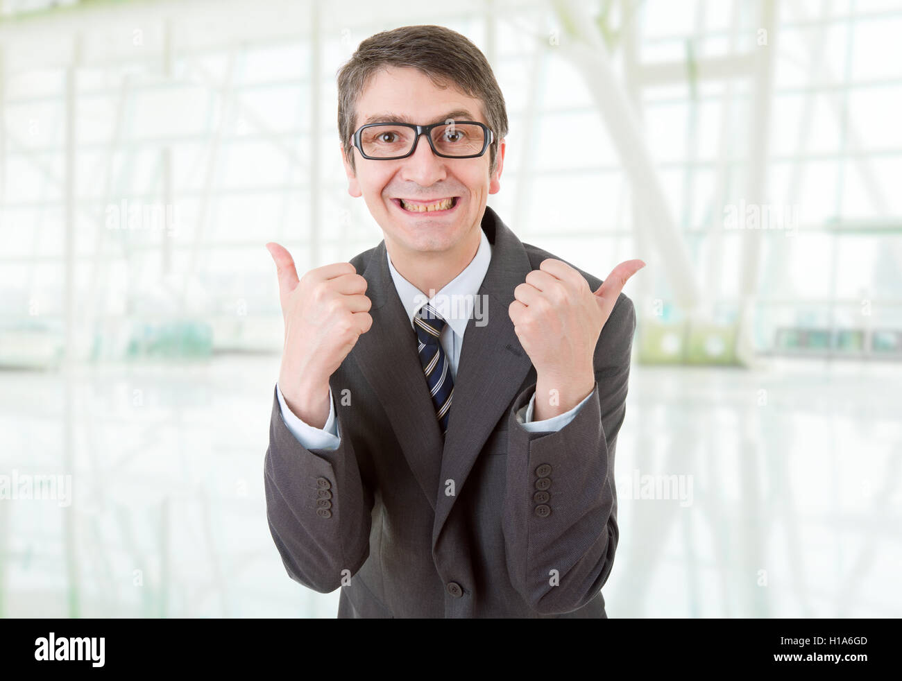 young business man going thumb up, at the office Stock Photo - Alamy