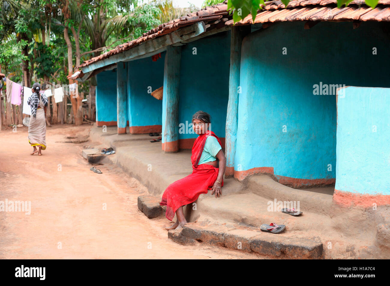 Old woman sitting outside the house, Bison Horn Maria Tribe, Gamawada ...