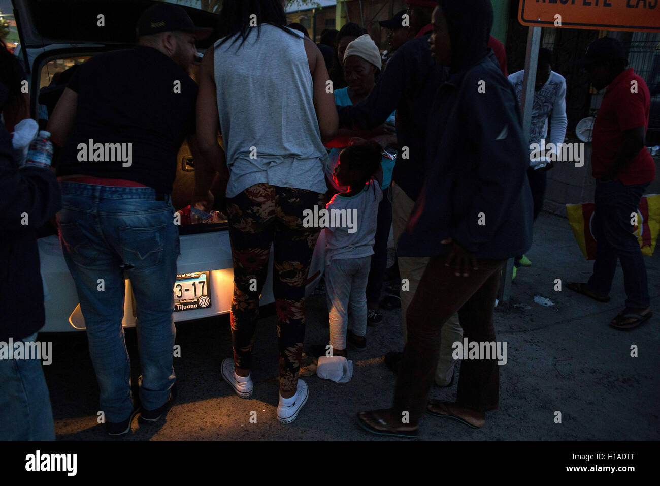 Tijuana, BAJA CALIFORNIA, MEXICO. 19th Sep, 2016. Locals give food and ...