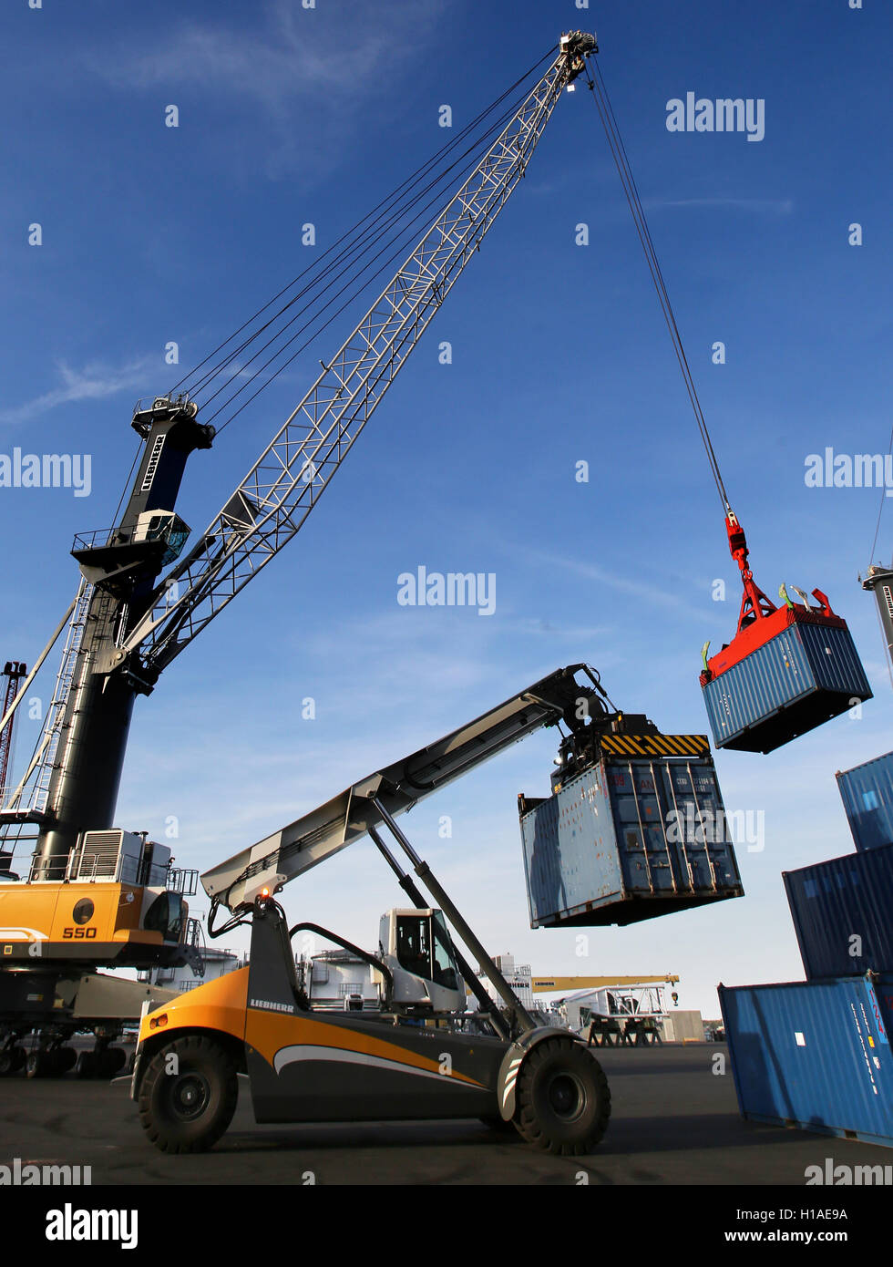 Rostock, Germany. 22nd Sep, 2016. Mobile harbor cranes and reach ...