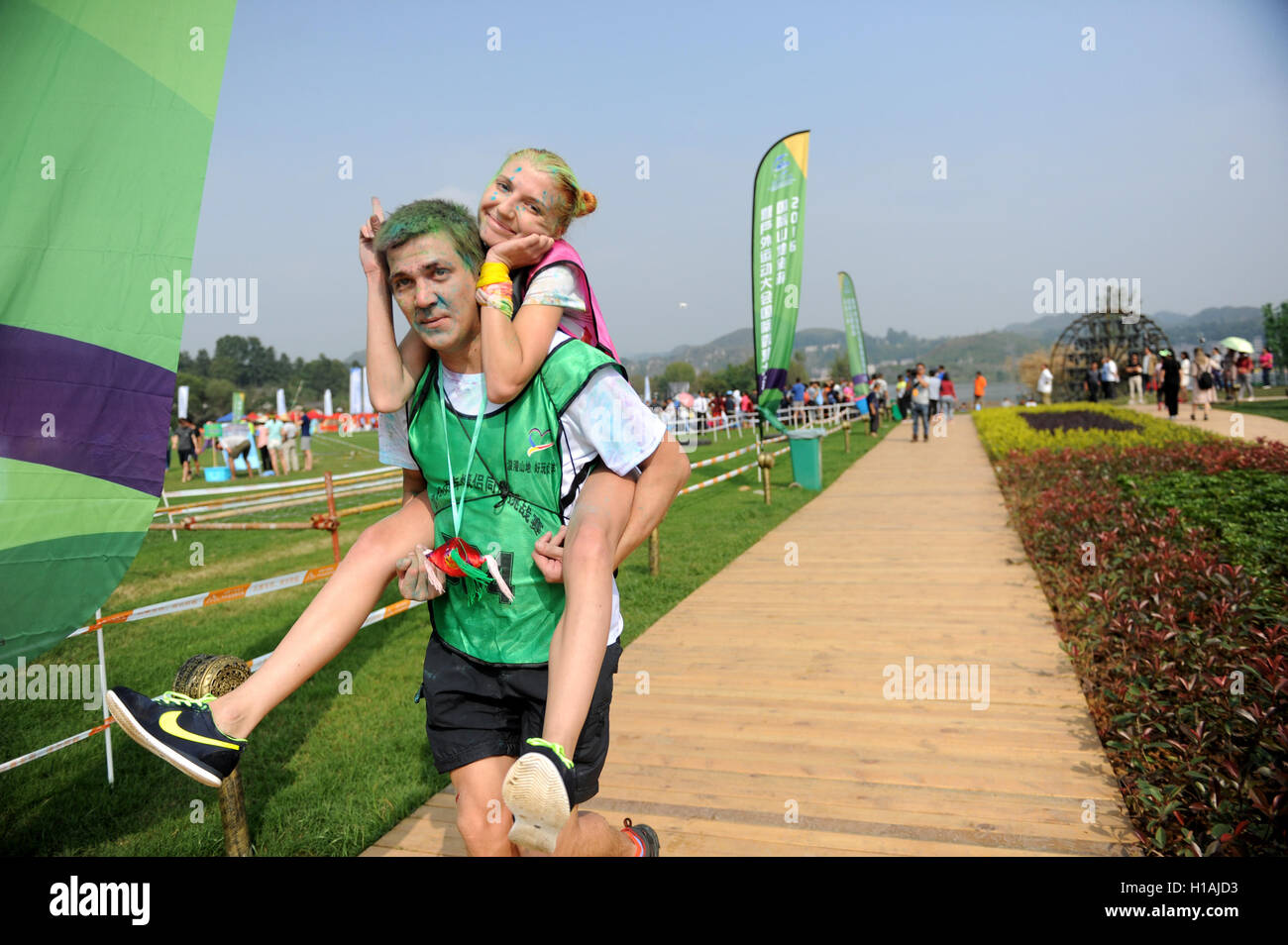 Zhenfeng, China's Guizhou Province. 23rd Sep, 2016. A couple run in the ...