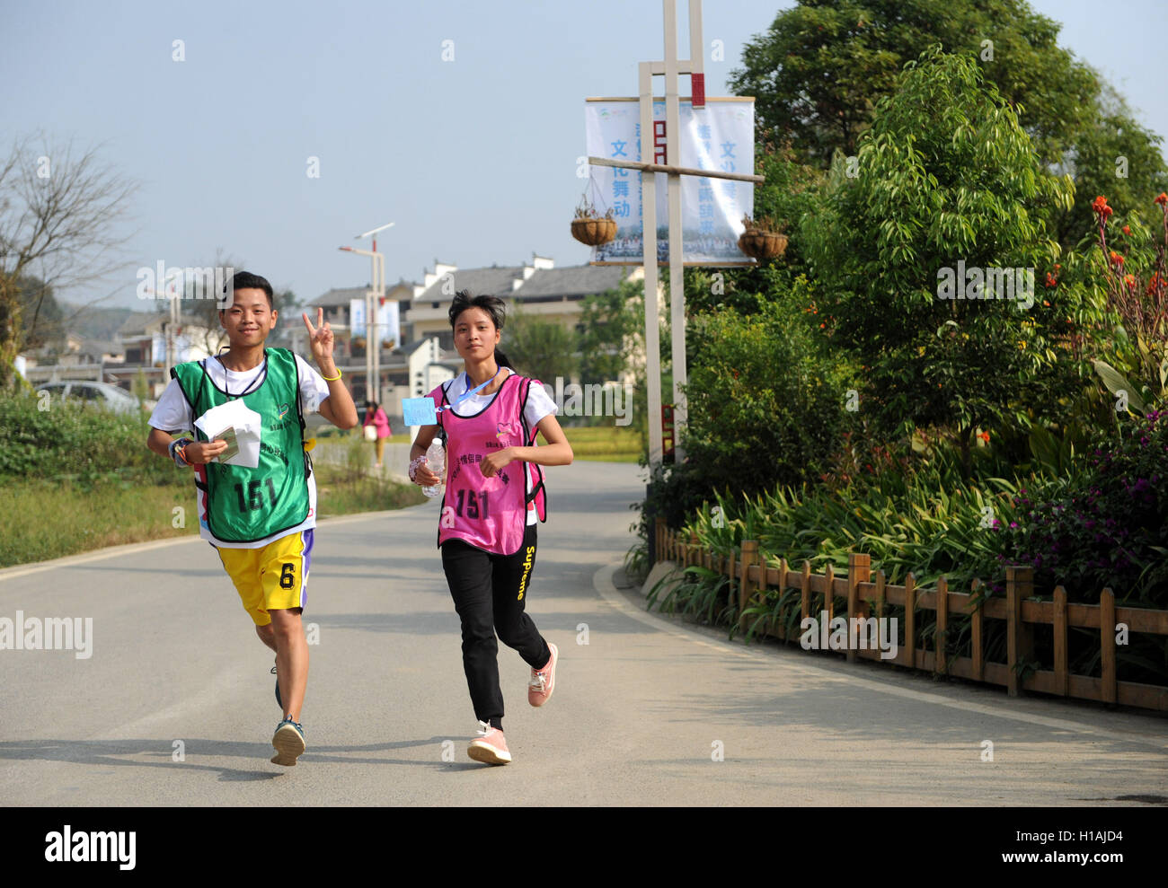 Zhenfeng, China's Guizhou Province. 23rd Sep, 2016. A couple run in the ...