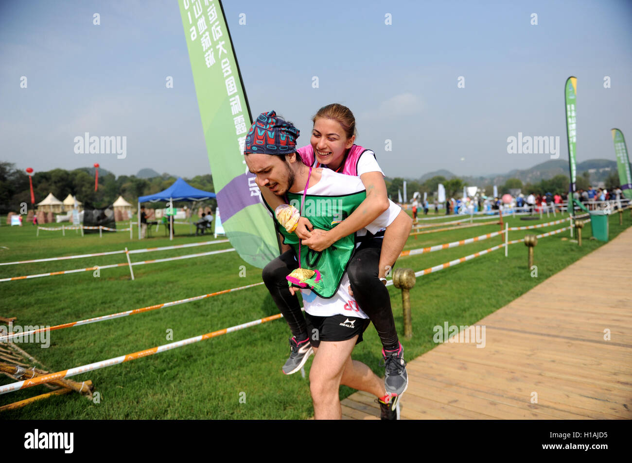 Zhenfeng, China's Guizhou Province. 23rd Sep, 2016. A couple run in the ...