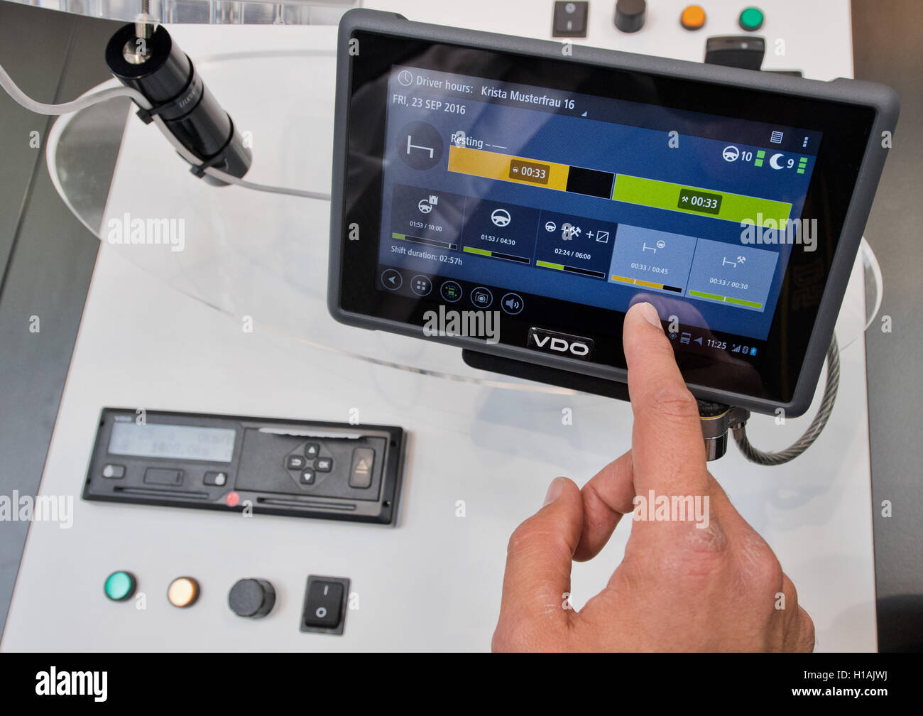 A digital tachograph (bottom L) and an additional monitor of the ...