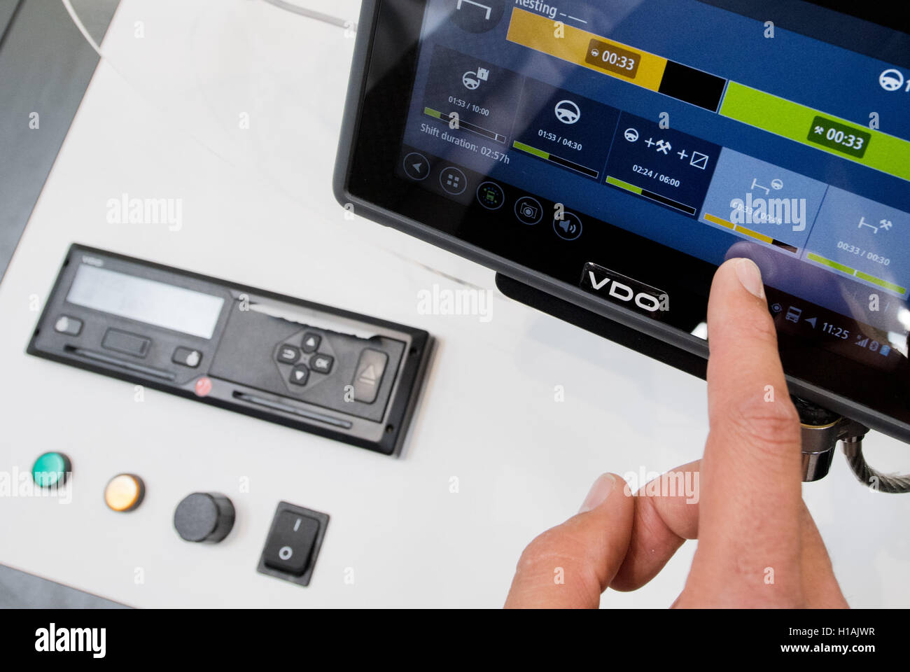 A digital tachograph (bottom L) and an additional monitor of the ...