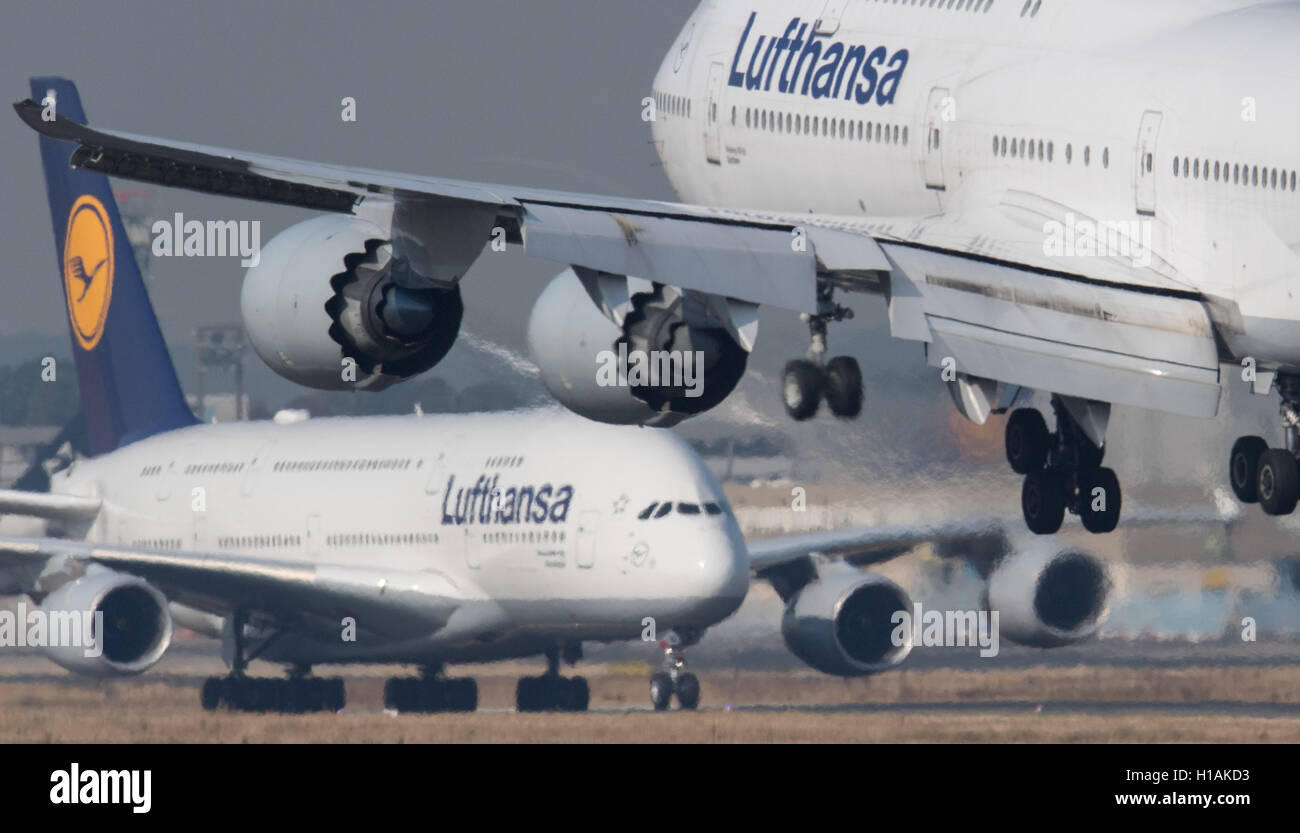 A Boeing 747 landing in front of an Airbus A-380 at the airport in ...