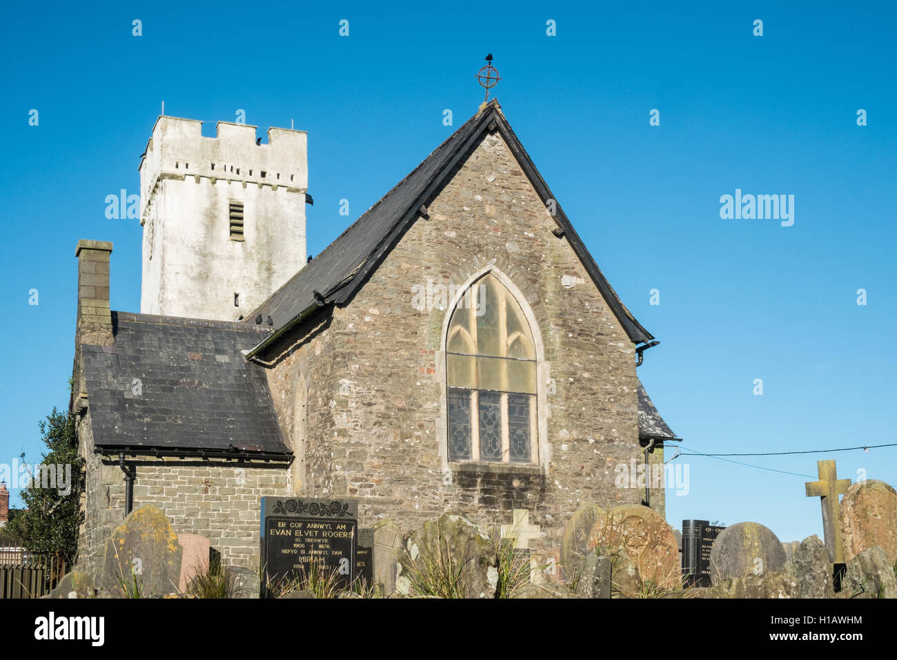 Ancient church and bell tower in centre of village of Llansaint,a ...