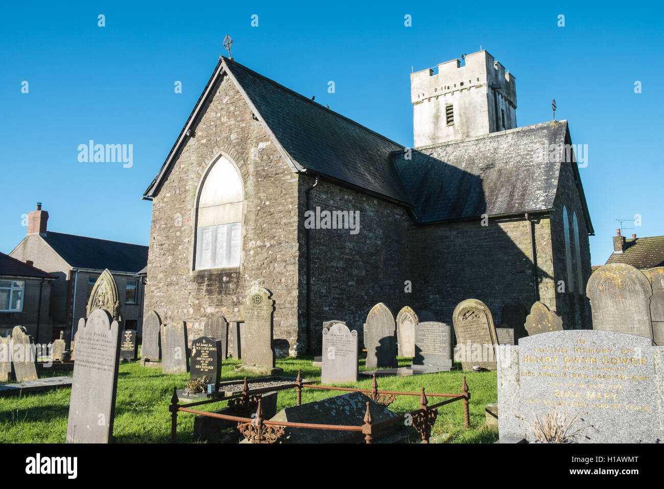Ancient church and bell tower in centre of village of Llansaint,a ...