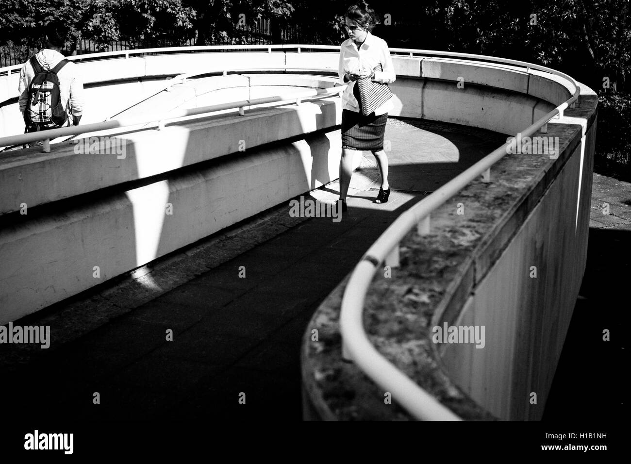 Visitors walk the exit ramp outside the Bauhaus Museum, Berlin, Germany ...