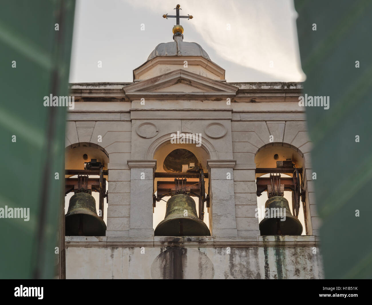 Three bells in old church tower, Venice, Italy, seen through open ...