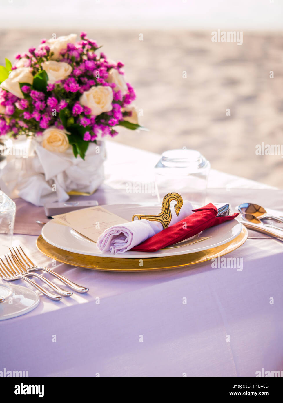 Romantic dinner table set on the beach Stock Photo - Alamy